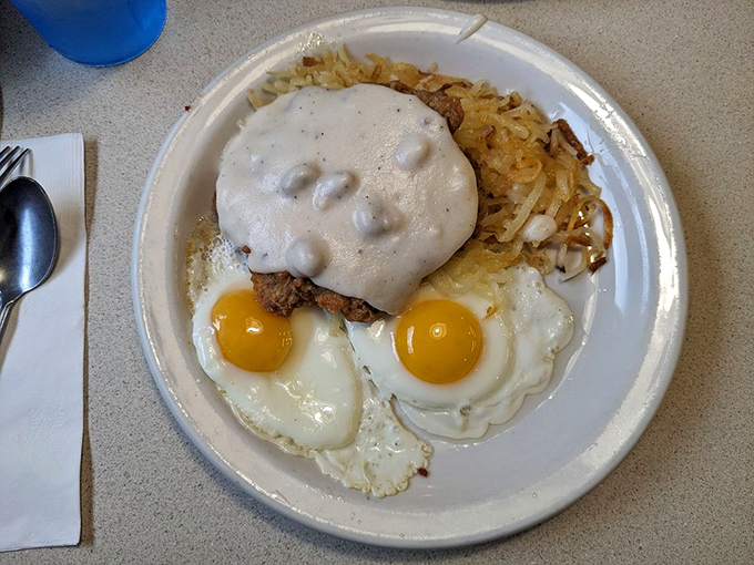 Country fried steak crowned with gravy, flanked by sunny-side-up eggs&mdash;a plate that says "You won't need dinner tonight."