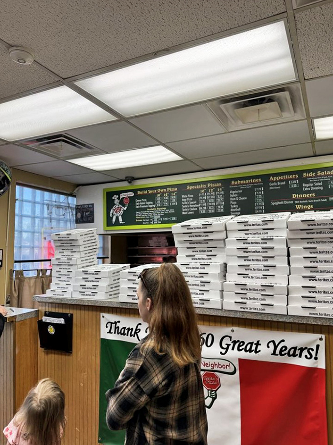 The weekend pizza rush—where stacks of boxes await hungry customers who've made the pilgrimage to this North End institution.