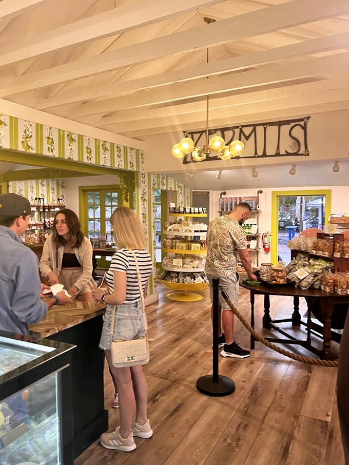 Customers contemplating their citrus choices with the seriousness such decisions deserve. The lime-striped wallpaper is basically subliminal advertising.