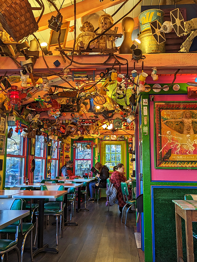 Every inch of wall and ceiling space hosts treasures that spark joy and conversation. Dining here is like eating inside a particularly delightful hoarder's mind.