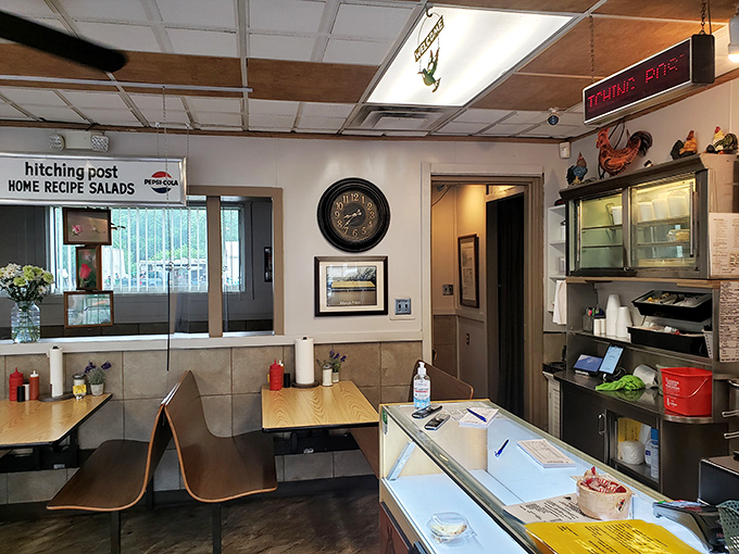 Unpretentious charm defines this space where homemade salads promise and chicken decor hints at the establishment's true passion.