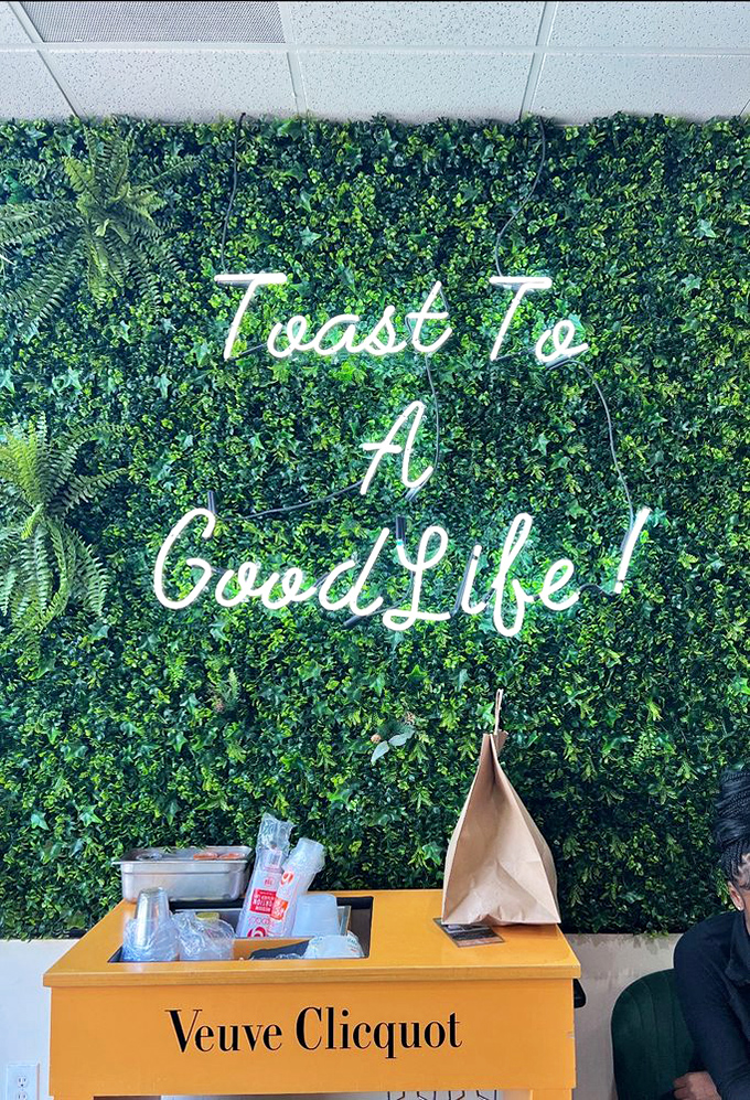 "Toast To A Good Life!" proclaims the lush green wall&mdash;a sentiment that's hard to argue with when you're surrounded by such Instagram-worthy d&eacute;cor.