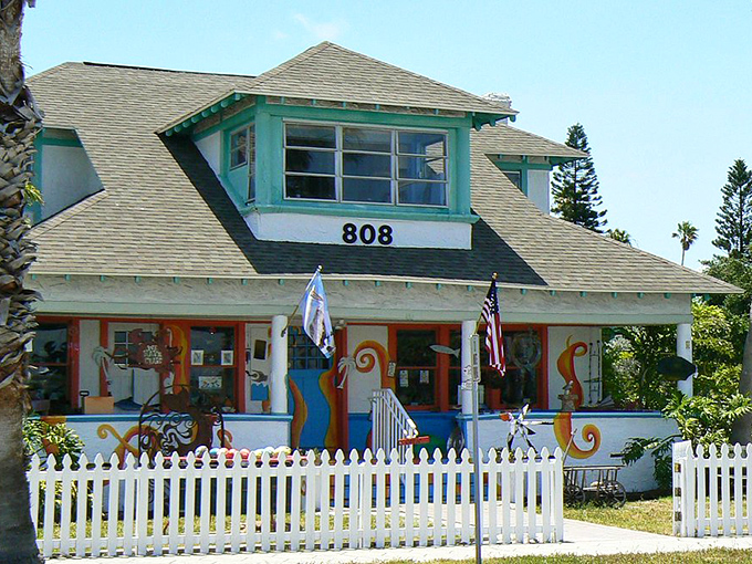 Whimsical and welcoming, this colorful cottage at 808 showcases the playful architecture that gives Pass-a-Grille its distinctive personality.