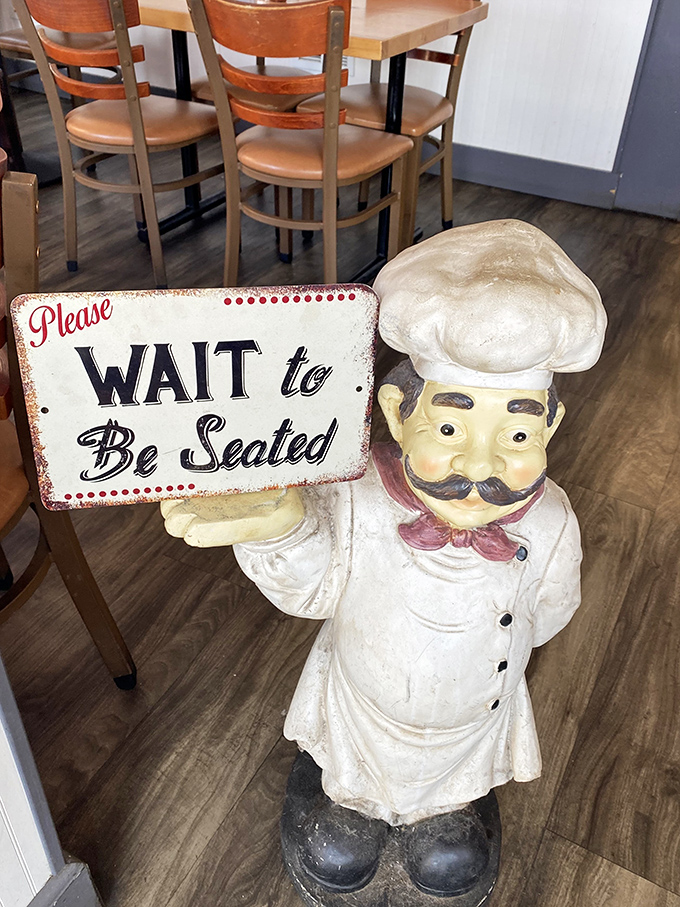 The chef statue's "Please WAIT to Be Seated" sign isn't just cute&mdash;it's delivered with the kind of authority that makes you instantly comply.