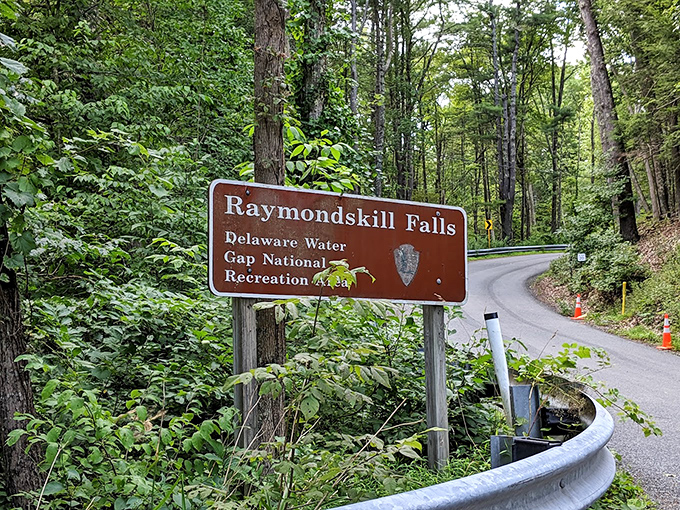 The official welcome sign marks your arrival at waterfall paradise, where Pennsylvania's tallest cascade awaits just around the bend.