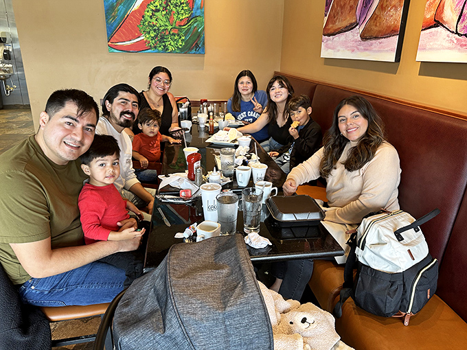 Happy families gather around tables, creating the kind of breakfast memories that last lifetimes.
