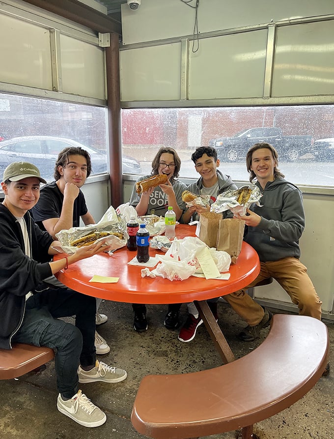 These young pilgrims embarking on their flavor journey look like they've discovered the secret to happiness wrapped in butcher paper.