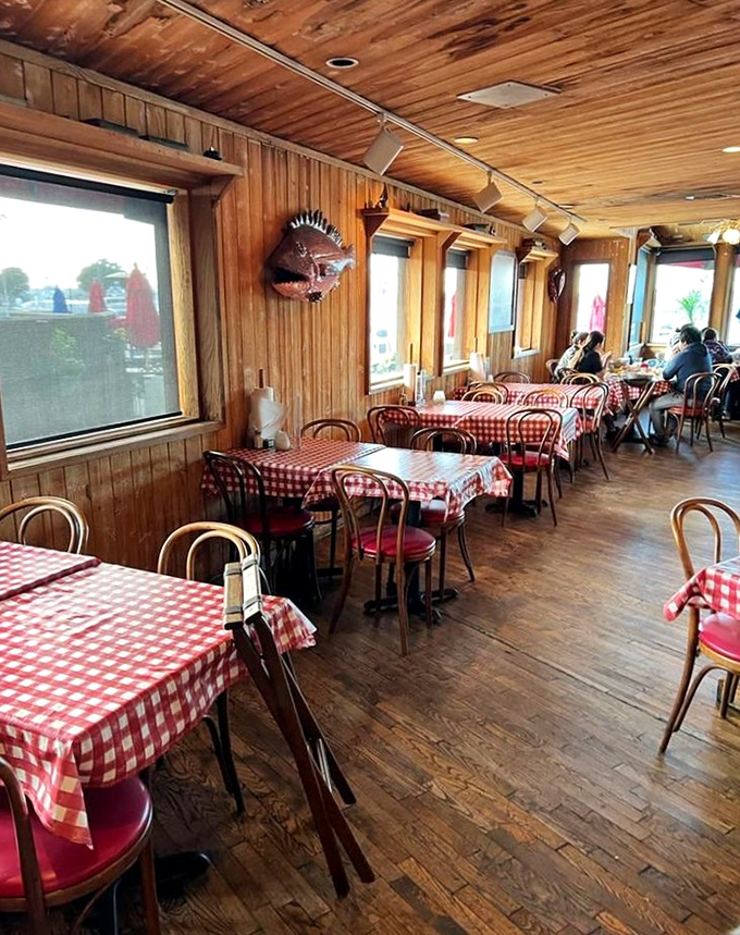 Red-checkered tablecloths and wooden paneling create that perfect "I've been coming here for years" vibe, even on your first visit.