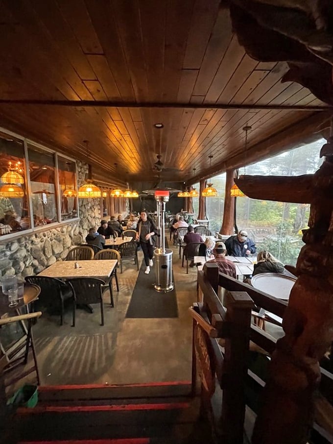 The covered porch offers shelter and spectacular views, where diners linger over meals while Lake Michigan stretches to the horizon like a blue tablecloth.