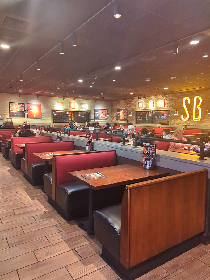 Red booths and wooden tables create that classic American restaurant feel&mdash;where conversations flow as freely as the barbecue sauce.