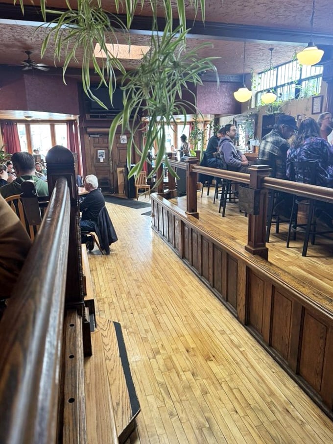 Not just a dining room but a community living room. Where wooden booths cradle conversations and hanging plants eavesdrop on local gossip.