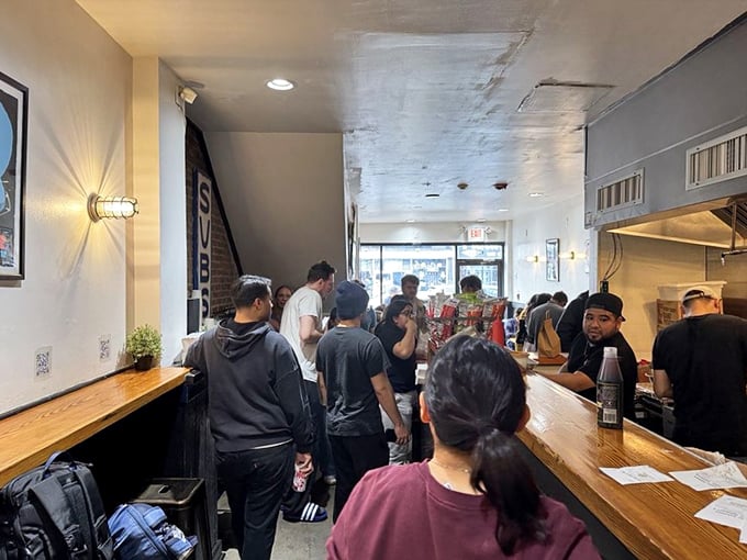 The universal language of "waiting for amazing food" is spoken fluently by everyone in this line. Worth every minute.