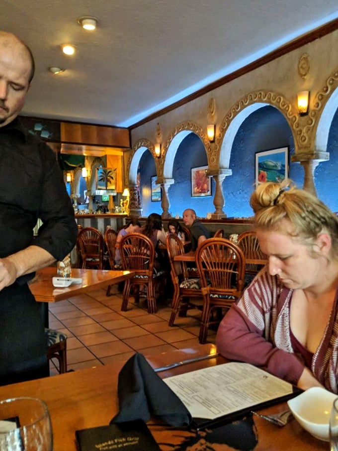 The warm glow of Island Fish Grill's dining room creates the perfect backdrop for making memories over meals worth remembering.