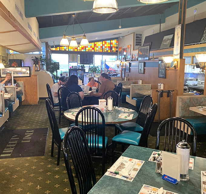 Green marble tables and black chairs create the perfect stage for breakfast theater, where every syrup pour gets a standing ovation.
