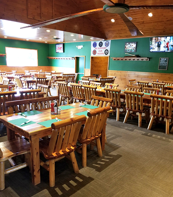 Empty tables waiting for the dinner rush&mdash;each log chair silently promising "the most comfortable food coma of your life."