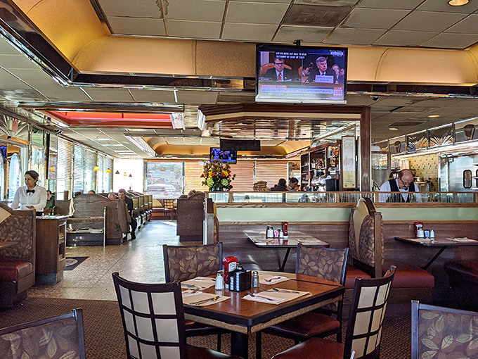 The dining room hums with the beautiful chaos of clinking plates and conversation—democracy in action, with pancakes.