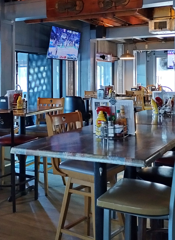 Metal tables, wooden chairs, and condiment caddies&mdash;the universal language of "we care more about our food than our furniture," and I'm here for it. 