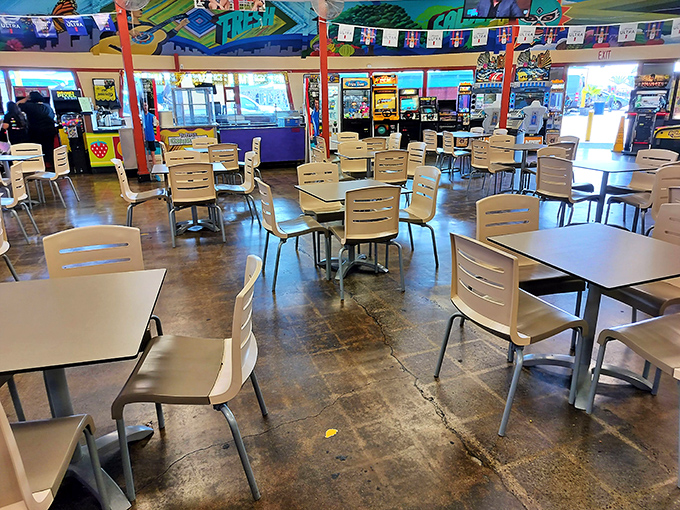 When hunger strikes, the food court awaits with empty tables soon to be filled with shoppers comparing their treasures over lunch.