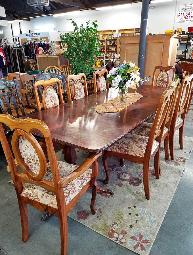 This elegant dining set awaits a new family to gather around it, complete with chairs that have witnessed countless conversations.