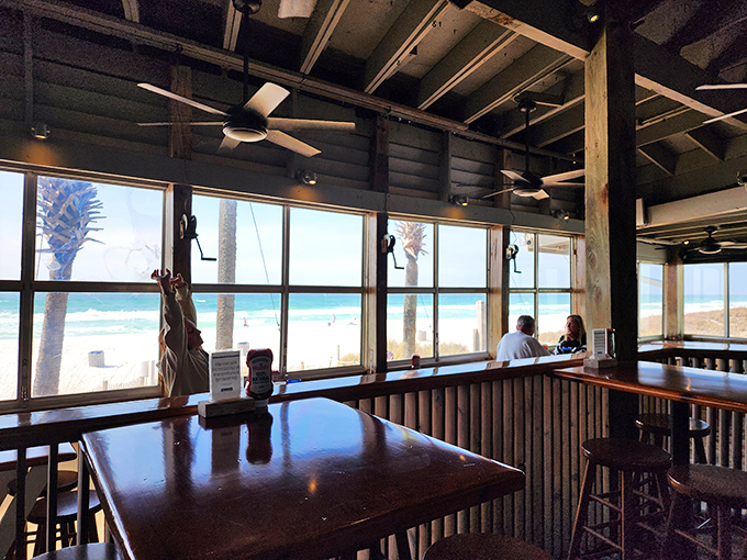 Those windows frame the Gulf like a living postcard. The view competes with the food for your attention—and everybody wins.