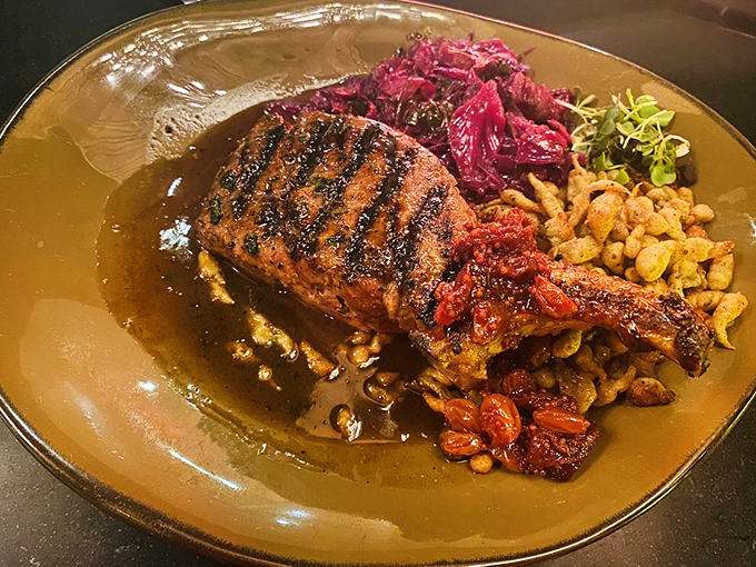 This pork chop isn't just dinner; it's a statement piece with its purple cabbage crown and golden corn throne. 