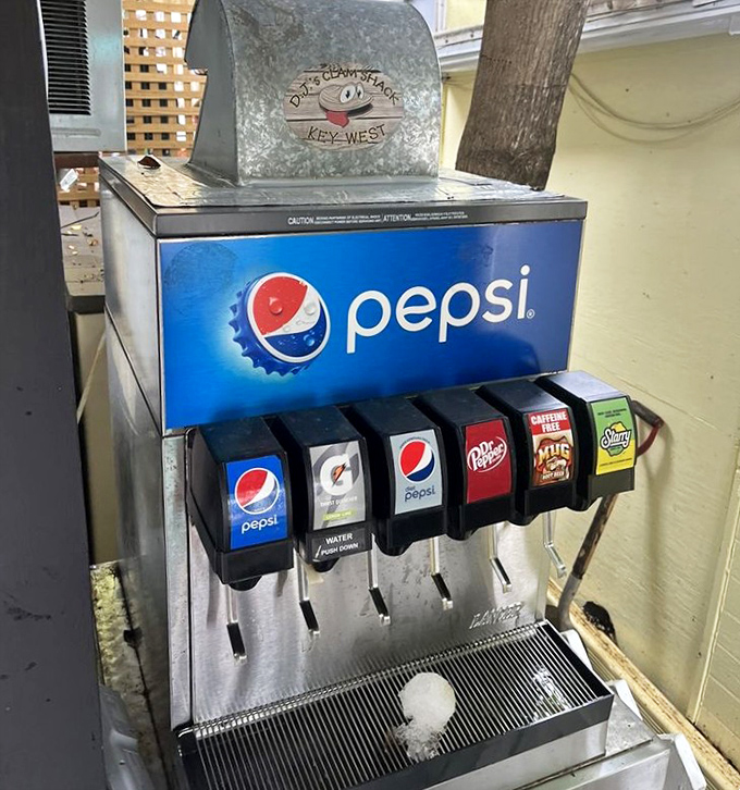 The humble soda machine: unsung hero of spicy seafood feasts. Those six buttons represent salvation after a mouthful of hot sauce.