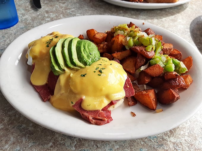 Eggs Benedict gets the California treatment with fresh avocado, creating a breakfast masterpiece that's both familiar and excitingly new.