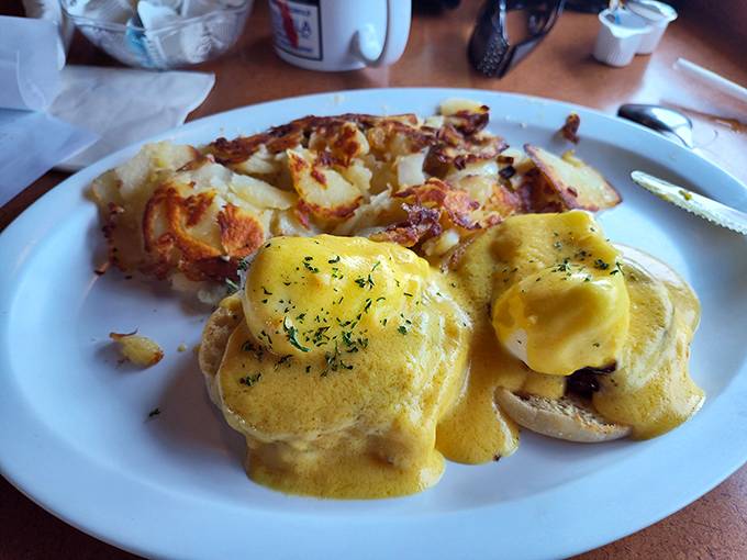 Eggs Benedict with hollandaise that cascades like a golden waterfall. Whoever said "perfection is impossible" clearly never tasted this breakfast masterpiece.