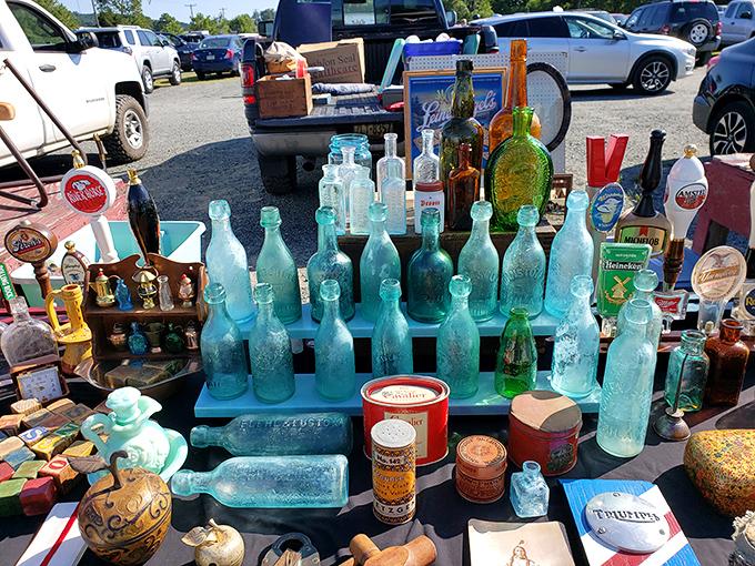 Sunlight dances through cobalt blue bottles arranged like an aquatic cityscape&mdash;yesterday's containers transformed into tomorrow's decor.