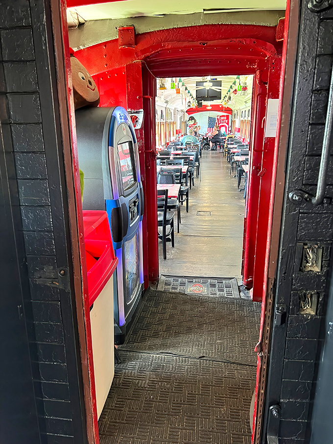 The entrance promises what every good doorway should: something better on the other side. In this case, it's comfort food in a train car.