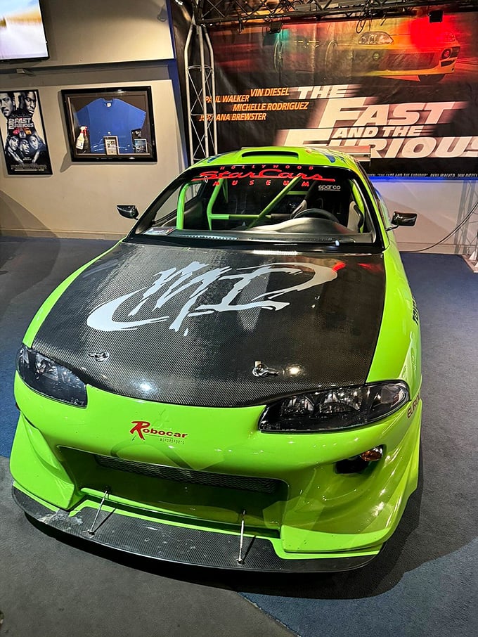 The neon green Eclipse from "The Fast and the Furious" practically vibrates with energy, its modified body and racing stripes screaming speed even while standing still.