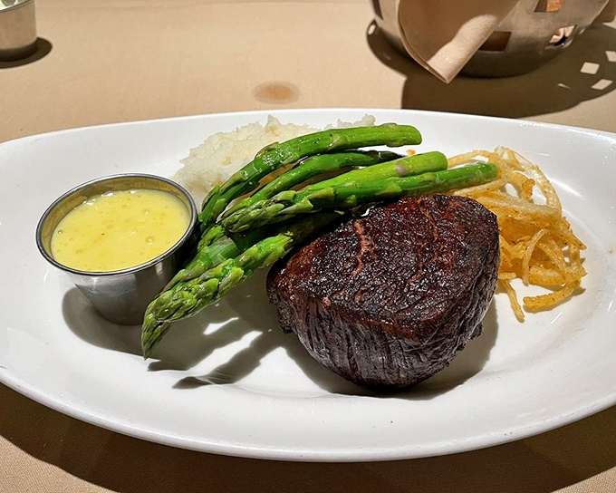A filet mignon so perfectly cooked it makes you wonder if the chef has some sort of meat telepathy. The asparagus is just showing off.