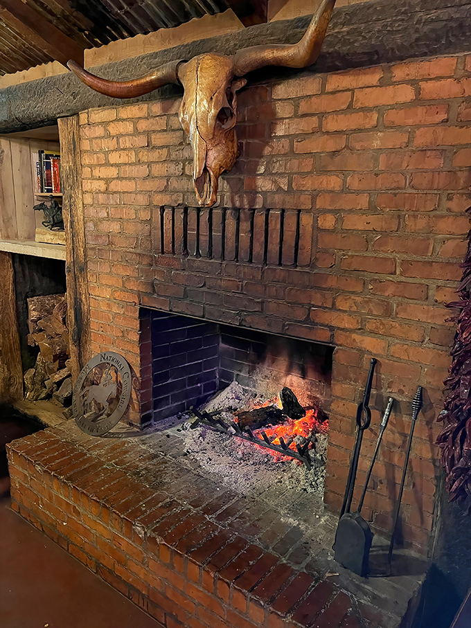 This isn't just a fireplace; it's the beating heart of Perini Ranch, where mesquite logs transform into the flavor that makes their steaks legendary.