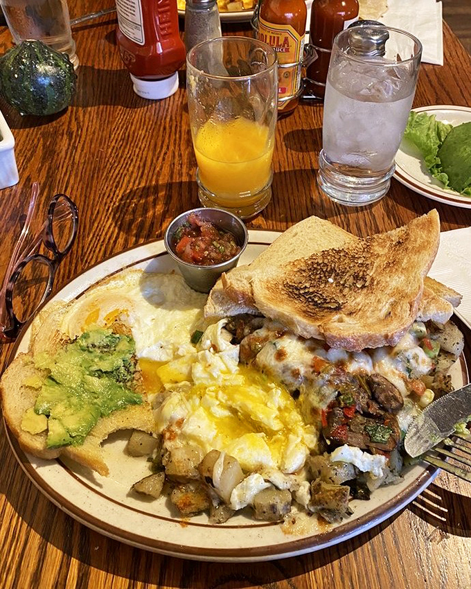 When breakfast can't decide what it wants to be, order this glorious plate where eggs, avocado, and potatoes live in perfect harmony.
