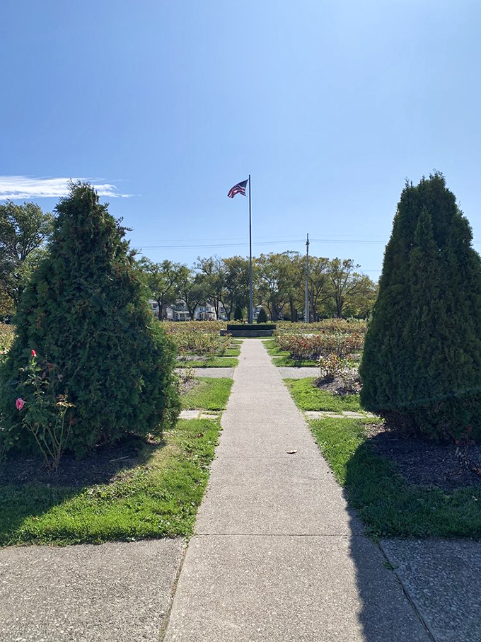 A perfectly manicured pathway through the garden leads to Old Glory waving against Ohio's brilliant blue summer sky.