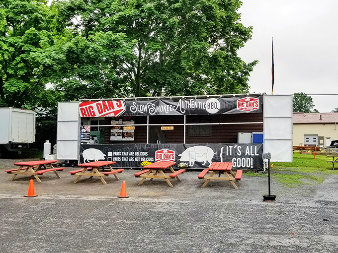 The outdoor stand extends Big Dan's reach beyond its barn walls. BBQ evangelism at its finest, converting hungry travelers one picnic table at a time.