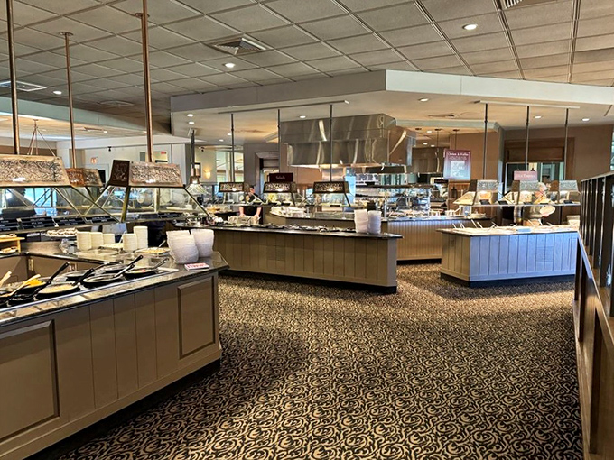 Food stations stretching into the distance like a buffet mirage. The pattern on the carpet cleverly hides the tracks of countless happy diners.