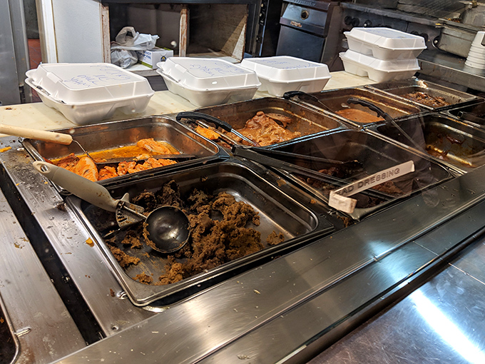 A glimpse behind the curtain at the treasures awaiting hungry patrons. Each tray holds someone's definition of the perfect meal.