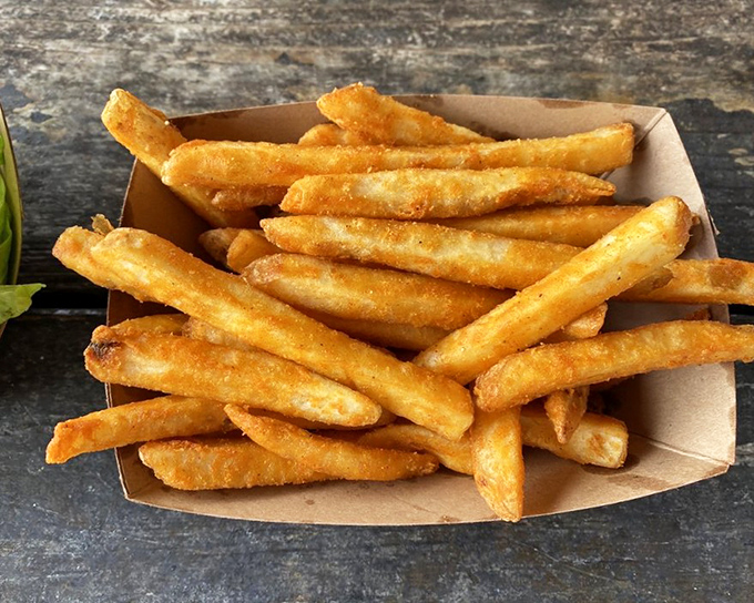 These aren't just any french fries. They're the golden, crispy co-stars that complement every seafood basket without stealing the spotlight.