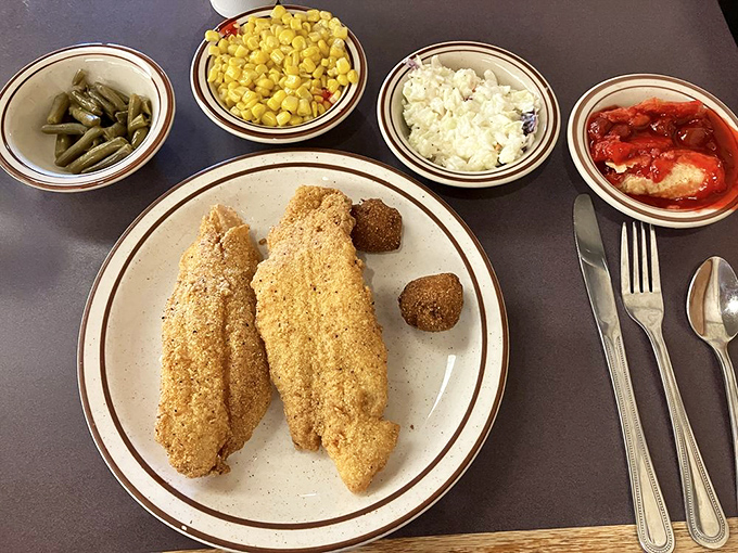 Fried catfish with a cornmeal crust so perfect it should have its own Instagram account. Those sides aren't just accompaniments &ndash; they're co-stars.