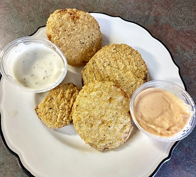 Fried green tomatoes with dipping sauces that could make a vegetable skeptic reconsider their life choices.