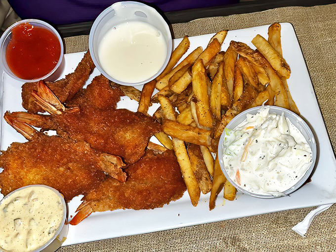 These golden-fried shrimp arrive with a crisp exterior giving way to perfectly cooked interiors. The trio of dipping sauces means every bite can be a new adventure.