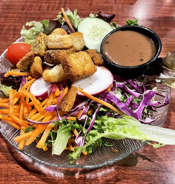 A garden salad that actually deserves the name "garden"&mdash;vibrant, colorful, and fresh enough to make you forget you ordered it just to feel virtuous. 