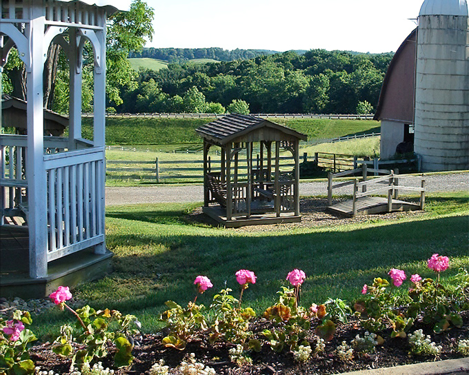 Pause and reflect. A handcrafted wooden gazebo offers a moment of quiet contemplation with views of pastoral farmland stretching beyond.