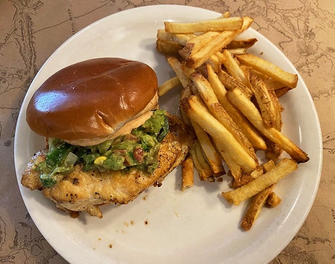 This chicken sandwich with its crown of avocado and fresh greens isn't just lunch&mdash;it's edible architecture that happens to taste amazing.