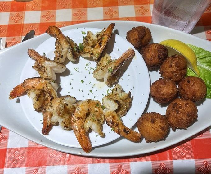 Perfectly grilled shrimp alongside golden hushpuppies &ndash; a plate that respects tradition while respecting your taste buds even more.
