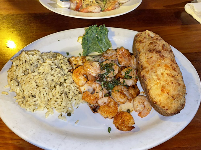 Grouper Destin showcases why this local fish deserves star treatment &ndash; flaky perfection topped with shrimp and that signature sauce.