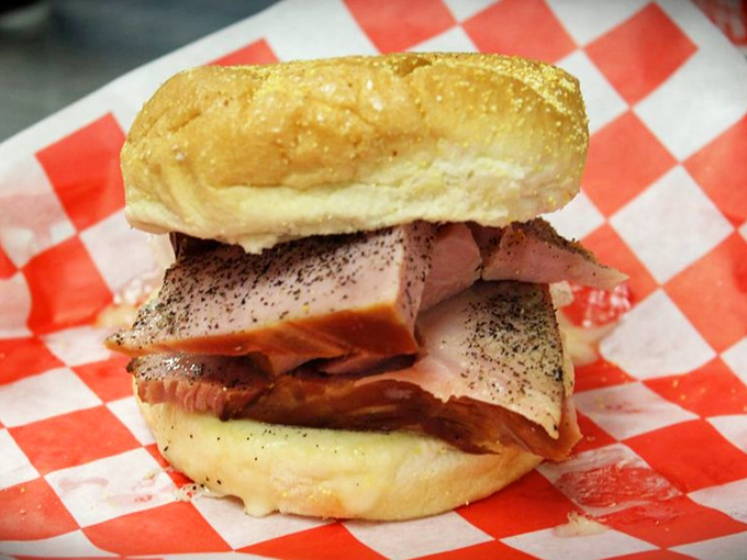 A ham sandwich that didn't get the memo about being humble. Those thick-cut slices are staging a delicious rebellion against ordinary lunch.