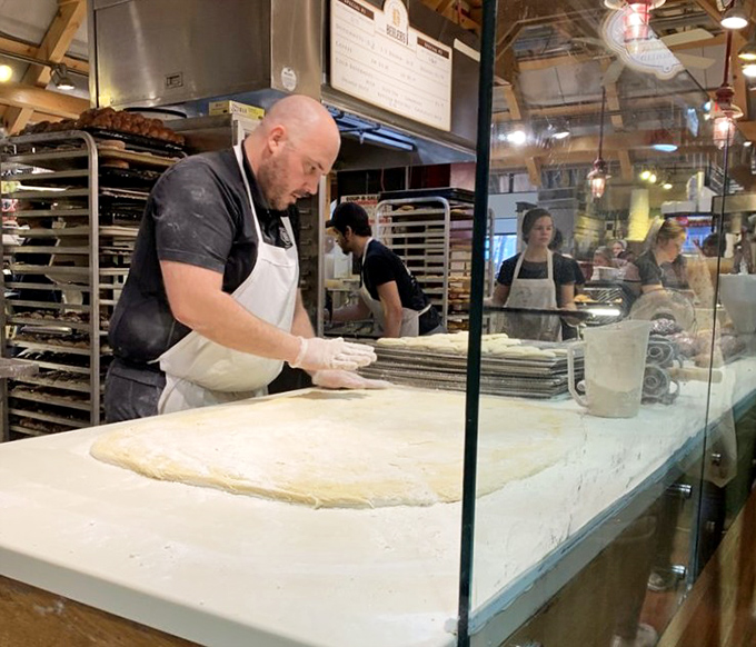 The ancient art of hand-rolling dough, practiced to perfection. Watching this process is almost as satisfying as eating the results.