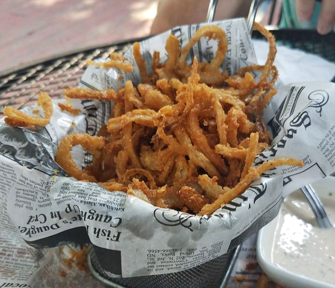 Crispy haystack onions that crunch like autumn leaves and disappear from the basket with suspicious speed.